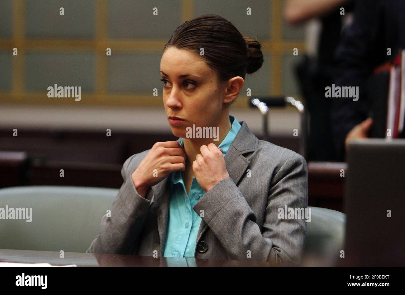 Casey Anthony, 24, adjusts her collar Friday, March 4, 2011, during the ...
