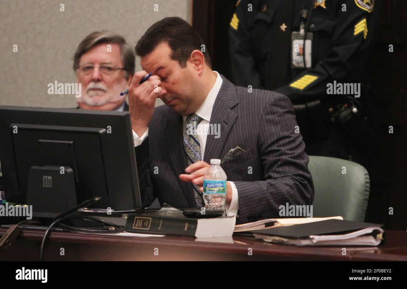 Defense attorneys Cheney Mason, left, and Jose Baez listen to Judge ...