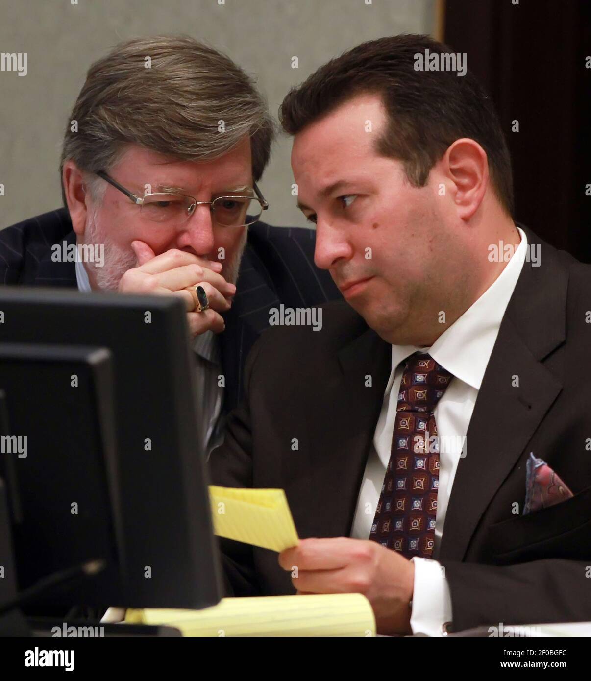 Defense counsel Jose Baez listens to co-counsel Cheney Mason, left ...