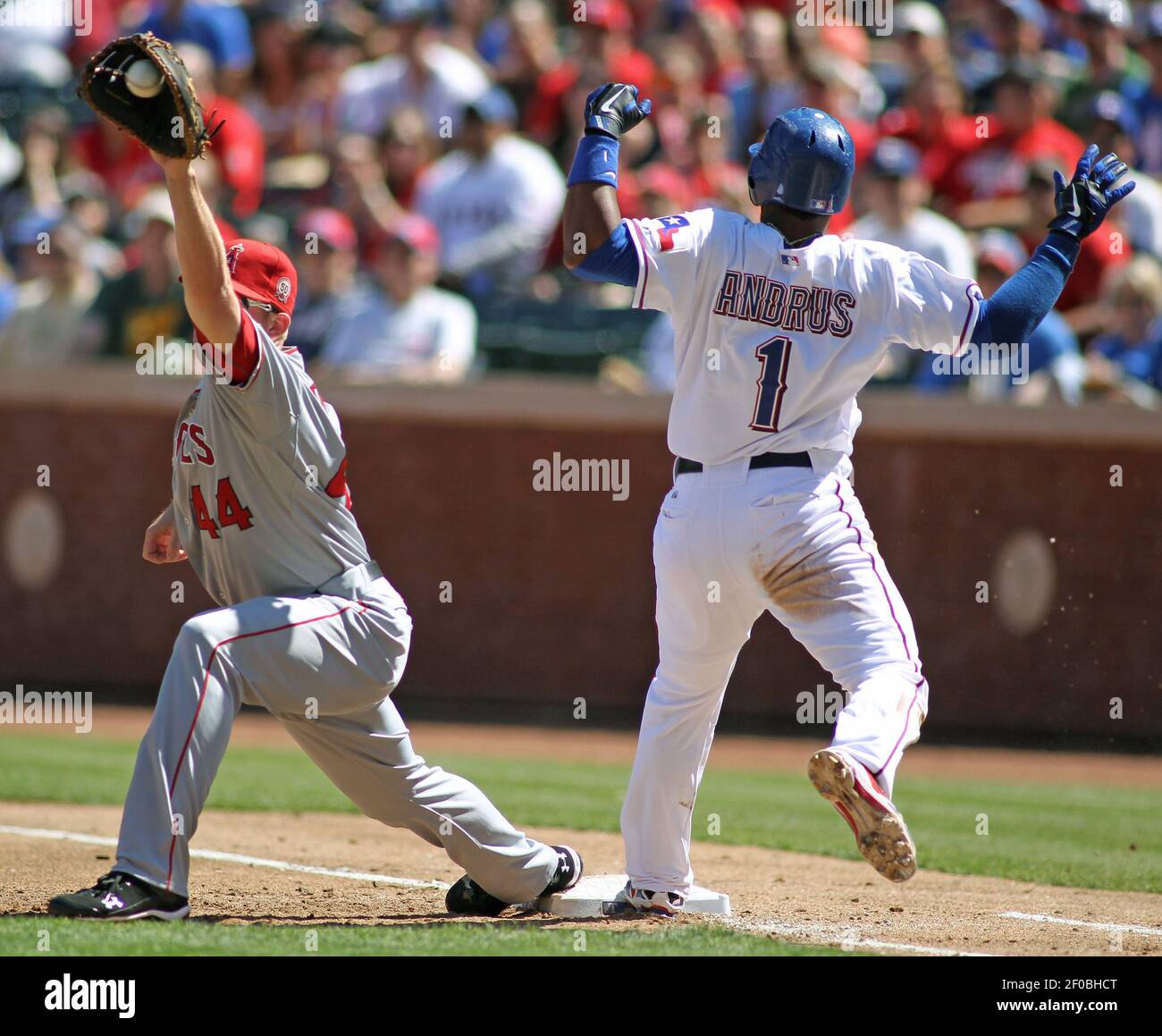 Texas Rangers' Elvis Andrus (1) is safe at first base as the Los ...