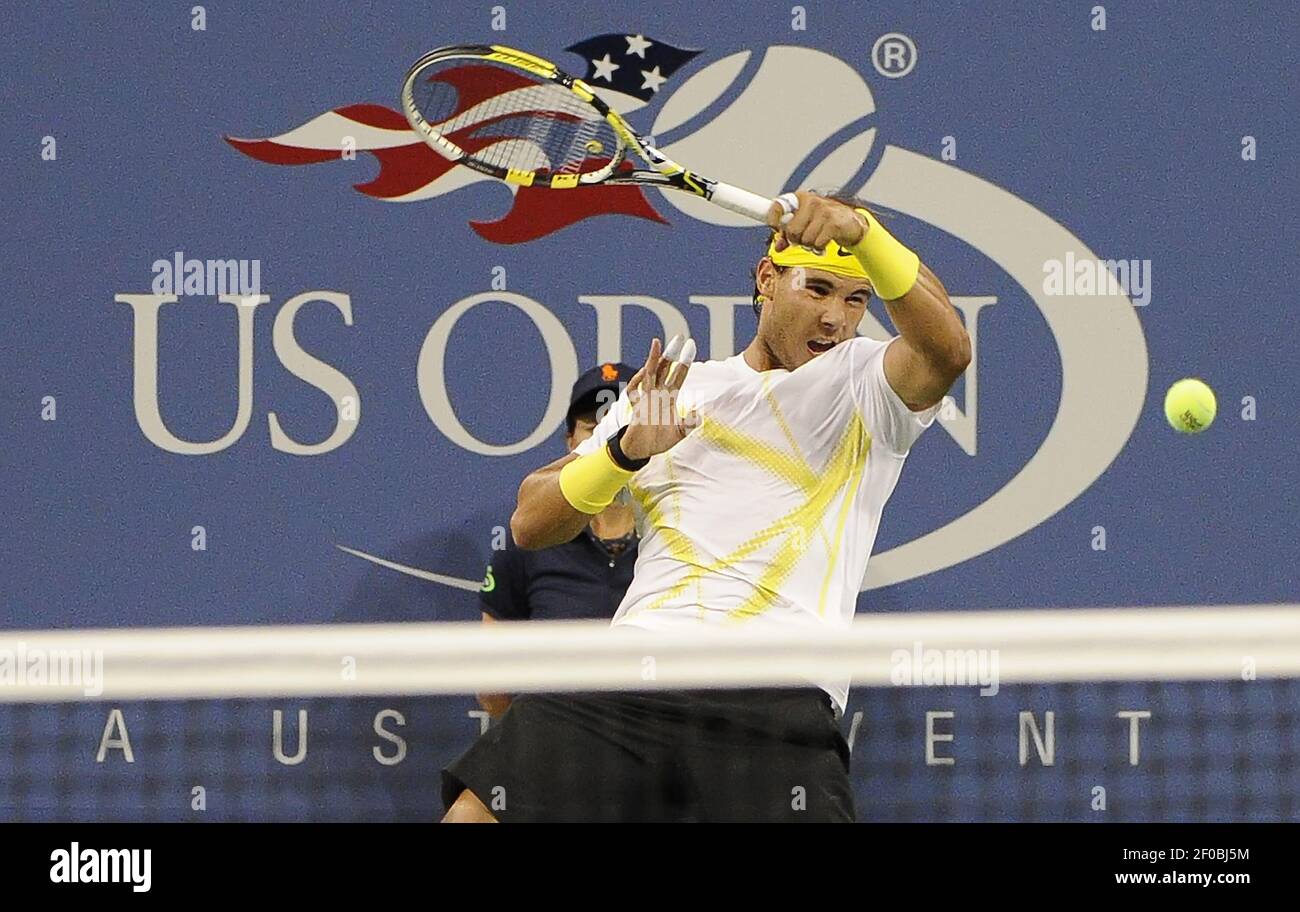 Rafael Nadal of Spain returns the ball to Andrey Golubev of Kazakhstan ...