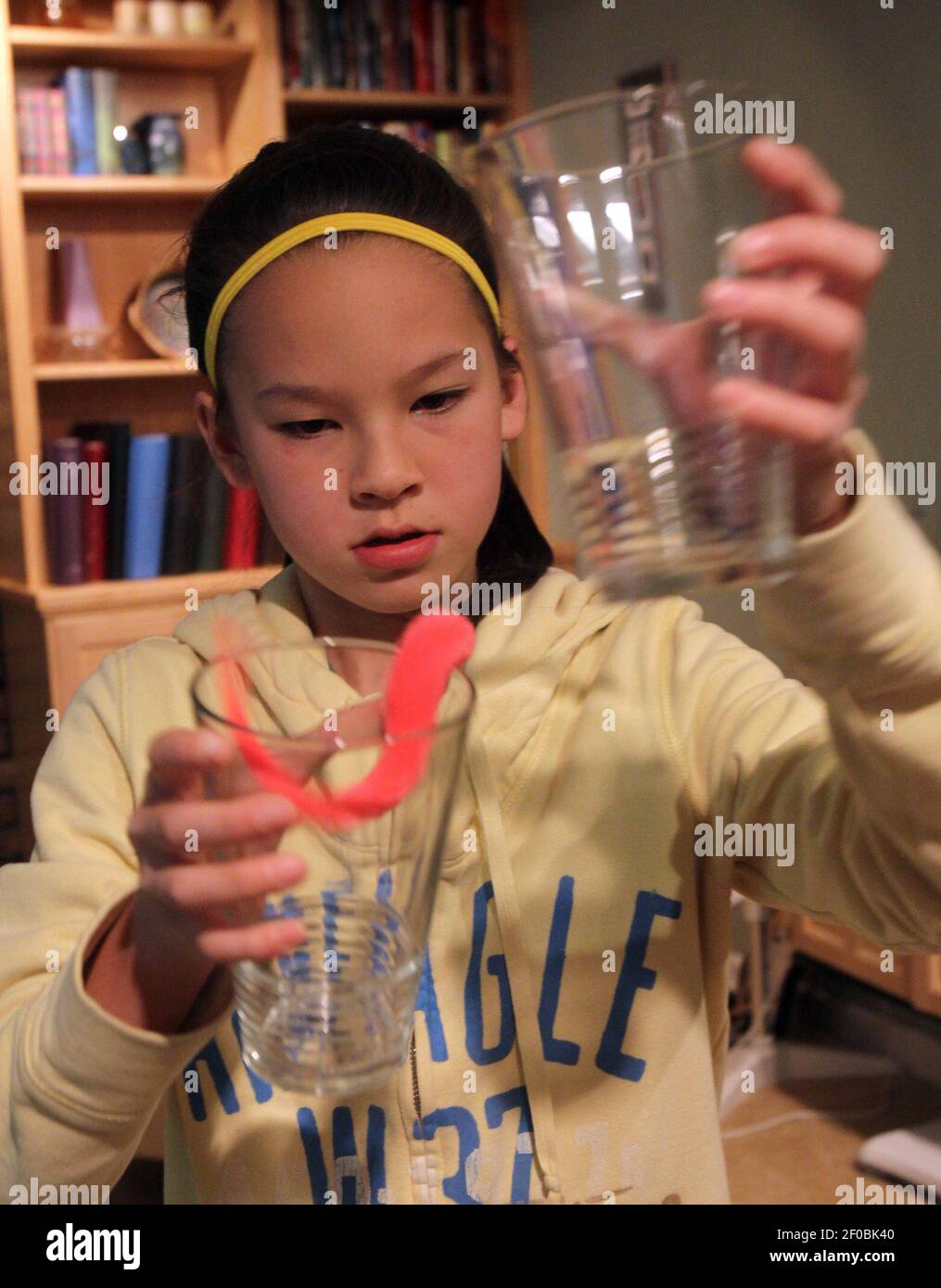 Becca Fisher, 10, tests "The Original Squirmles" by making it jump from ...