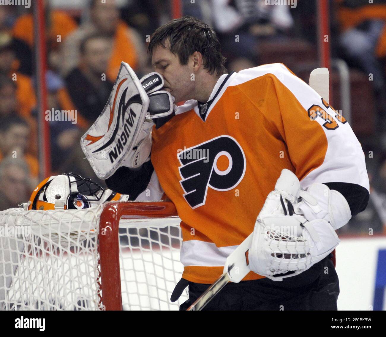 Philadelphia Flyers' goalie Brian Boucher covers his face after the Buffalo Sabres scored a ...