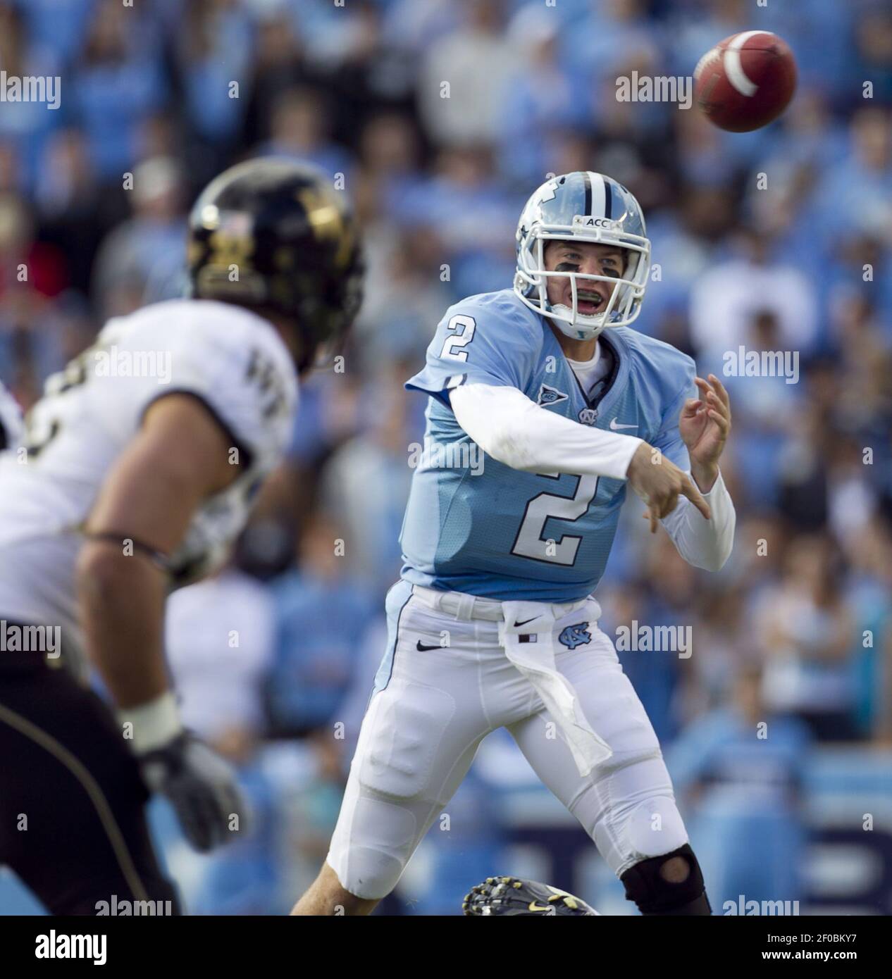 North Carolina quarterback Bryn Renner (2) fires off a pass to Giovani ...