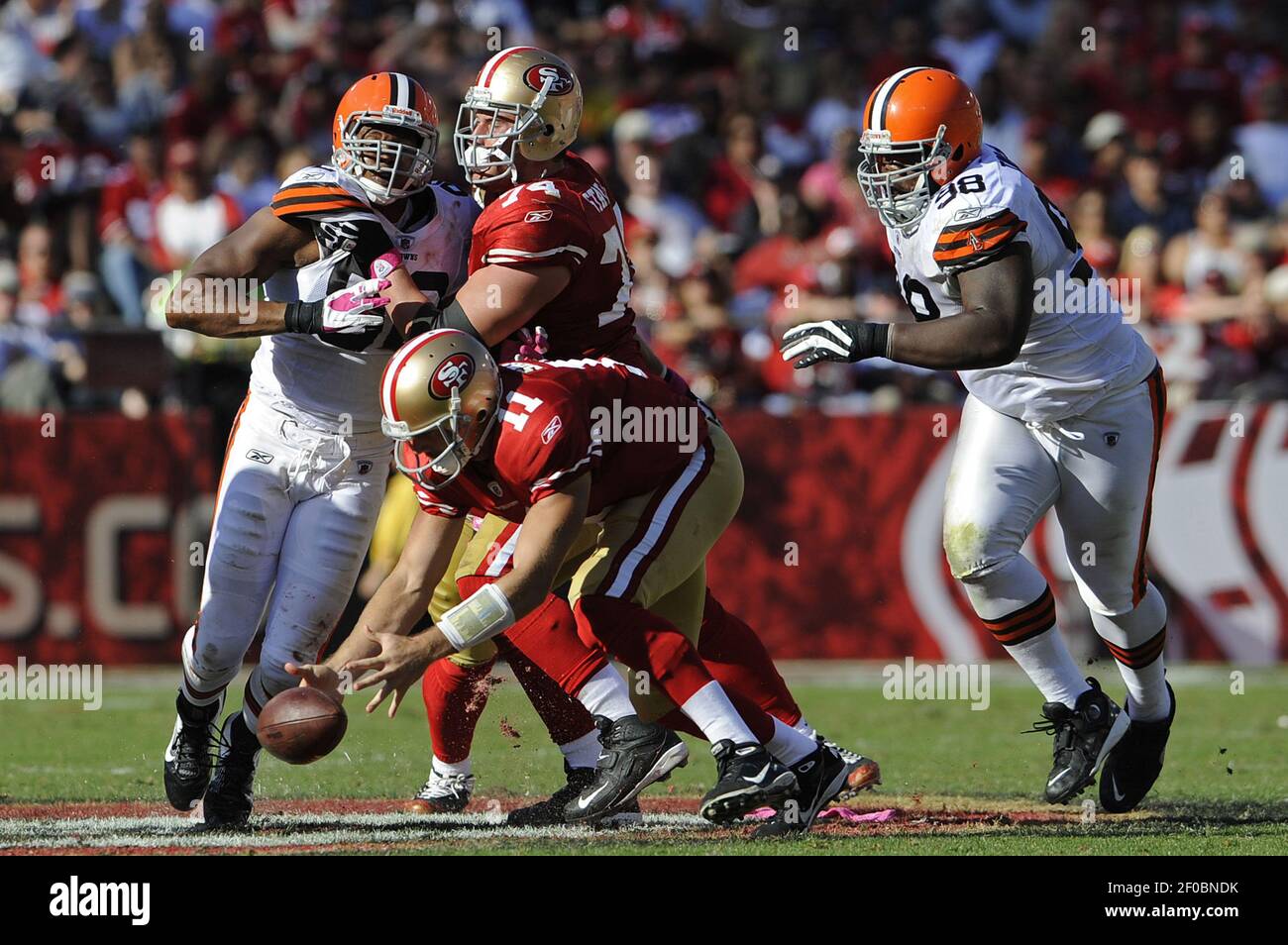 San Francisco 49ers quarterback Alex Smith (11) picks up his fumble ...
