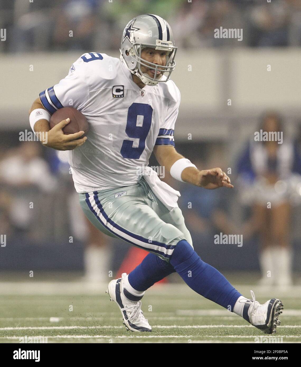Dallas Cowboys quarterback Tony Romo (9) runs for first down. The ...