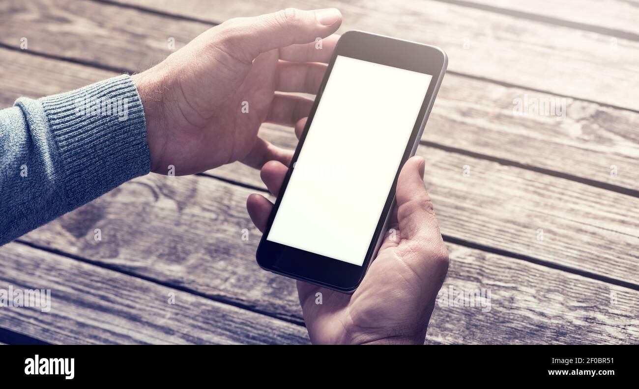Smartphone in hands. Clipping path included Stock Photo - Alamy