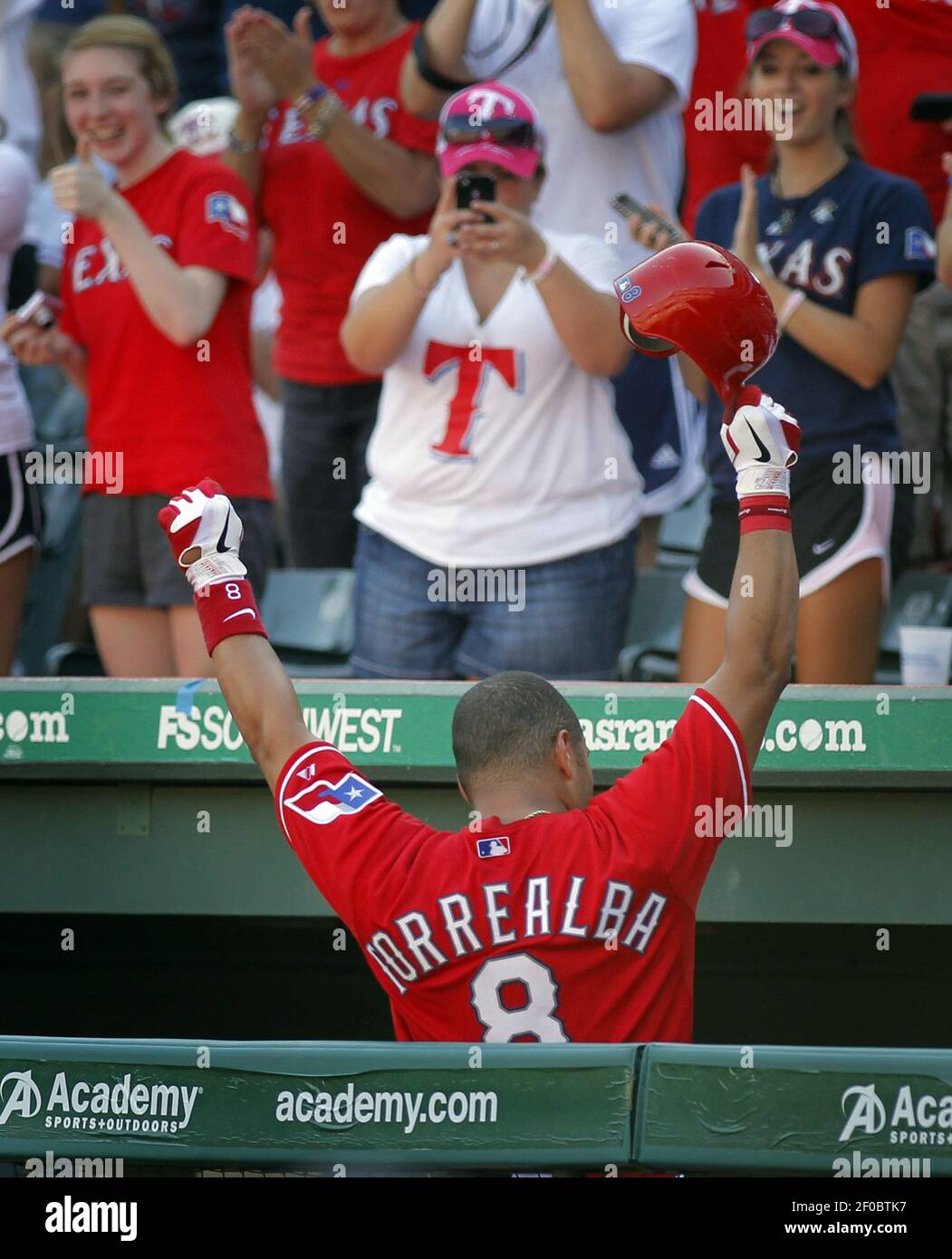 Texas Rangers catcher Yorvit Torrealba waves to the cheering crowd ...