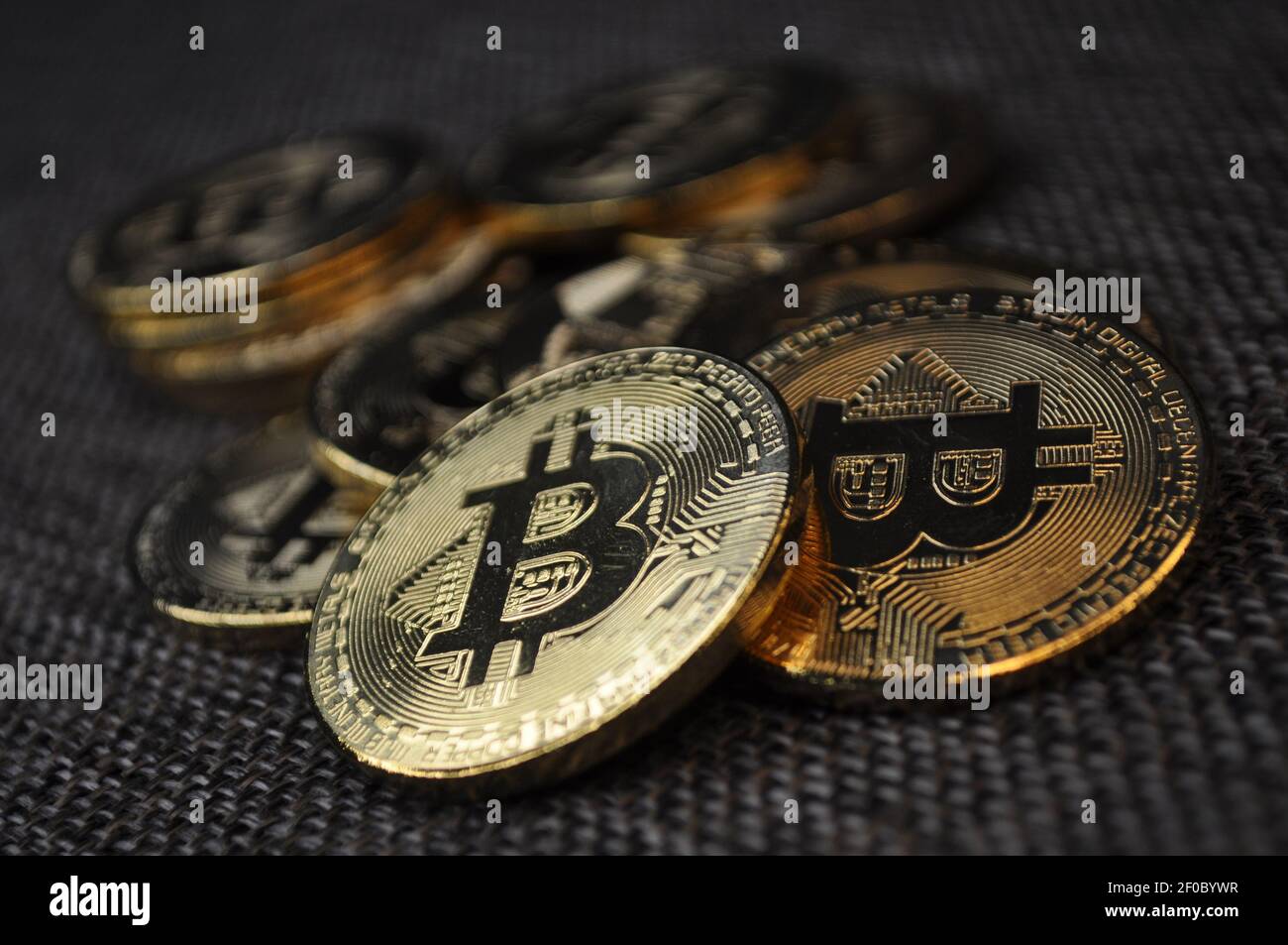 Macro view of gold and silver color shiny coins with Bitcoin symbol ...