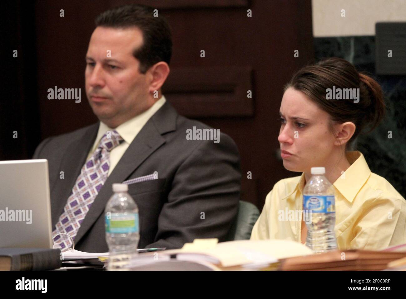 Casey Anthony, right, and her attorney Jose Baez watch a video being ...