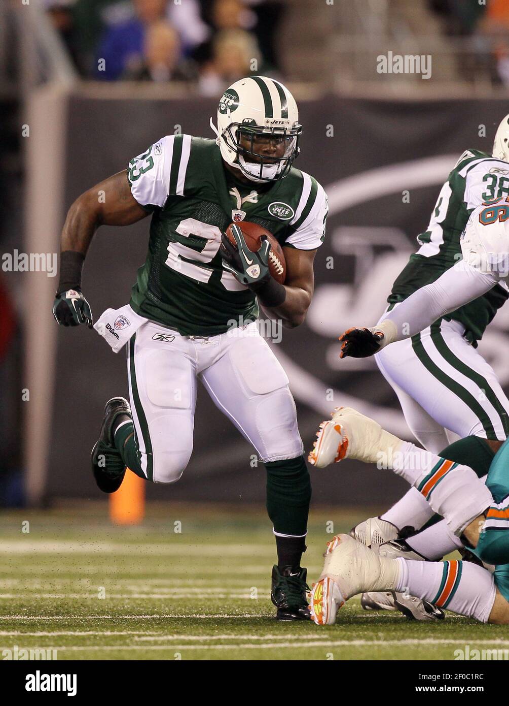 Shonn Greene of the New York Jets runs the ball against the Miami ...
