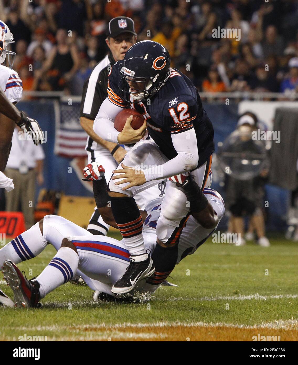 Chicago Bears quarterback Caleb Hanie (12) scores a second-quarter ...