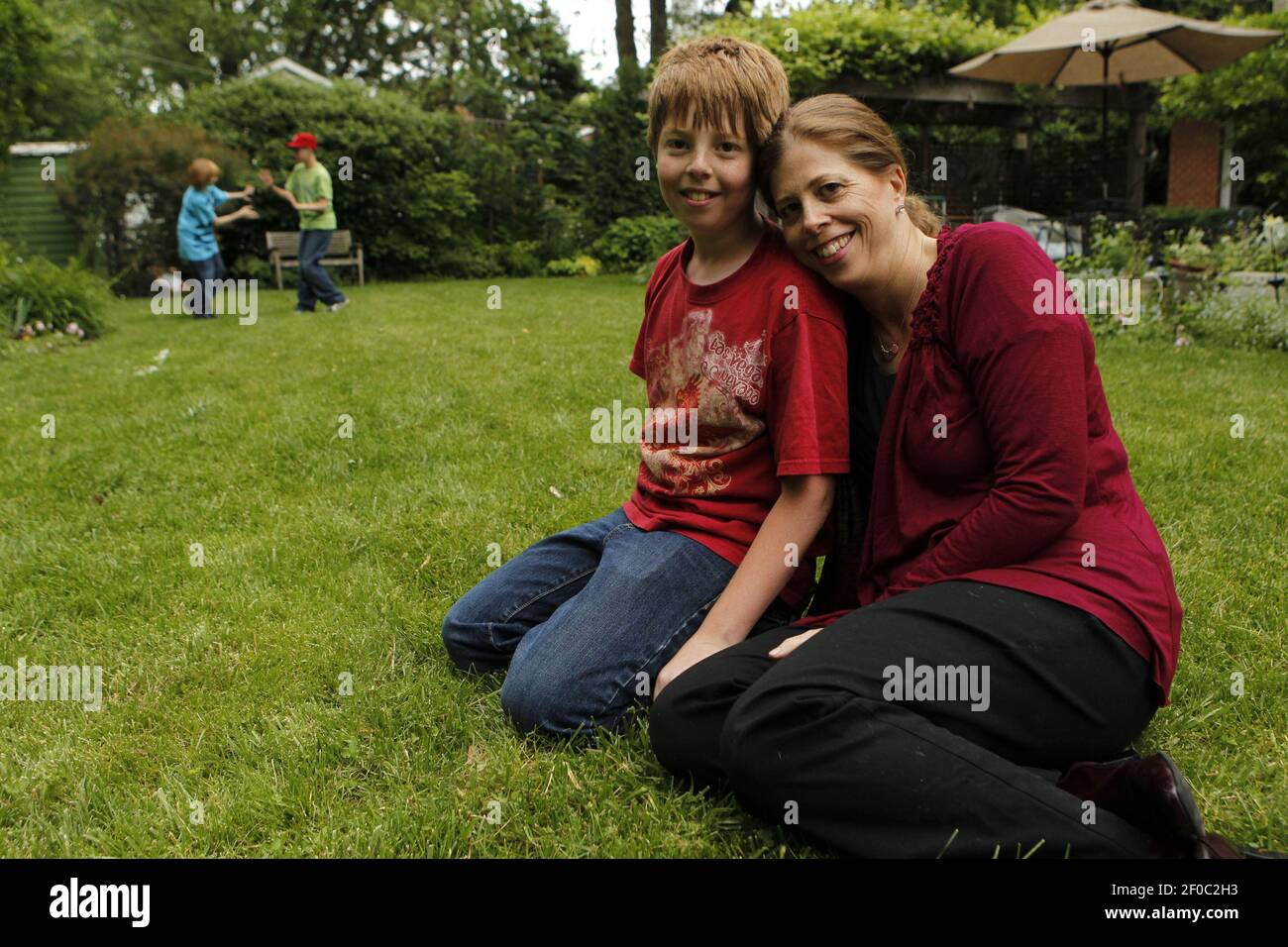 Rachel Rosenberg, right, and her son Theo Rosenberg, 12, pose for ...