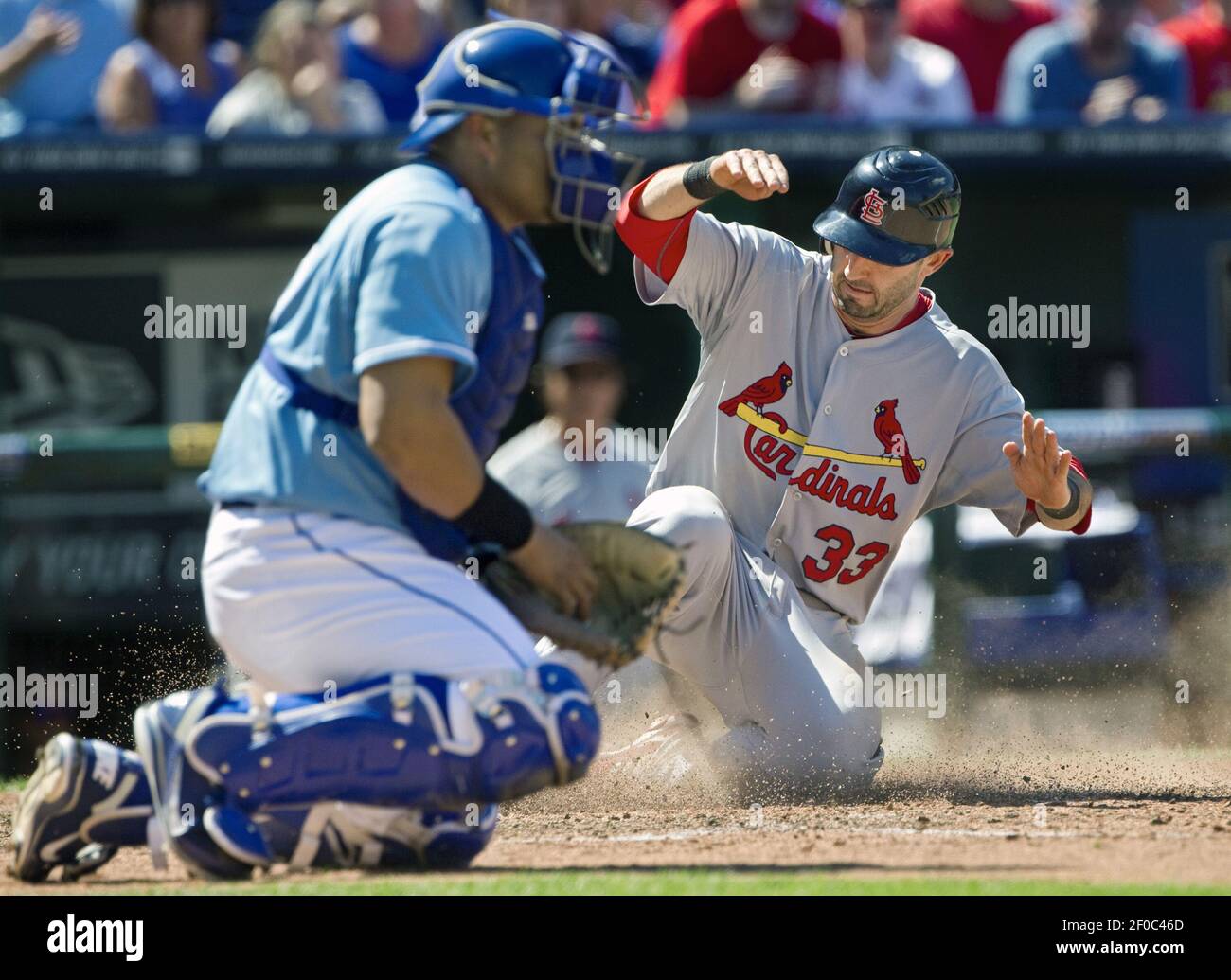 St. Louis Cardinals' Daniel Descalso (33) scores on a sacrifice fly by ...