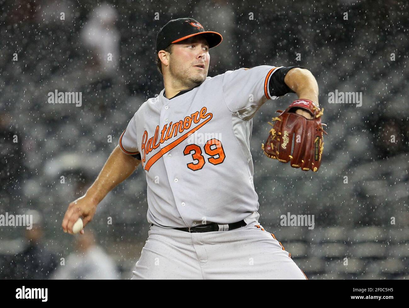 Tommy Hunter of the Baltimore Orioles pitches against the New York ...