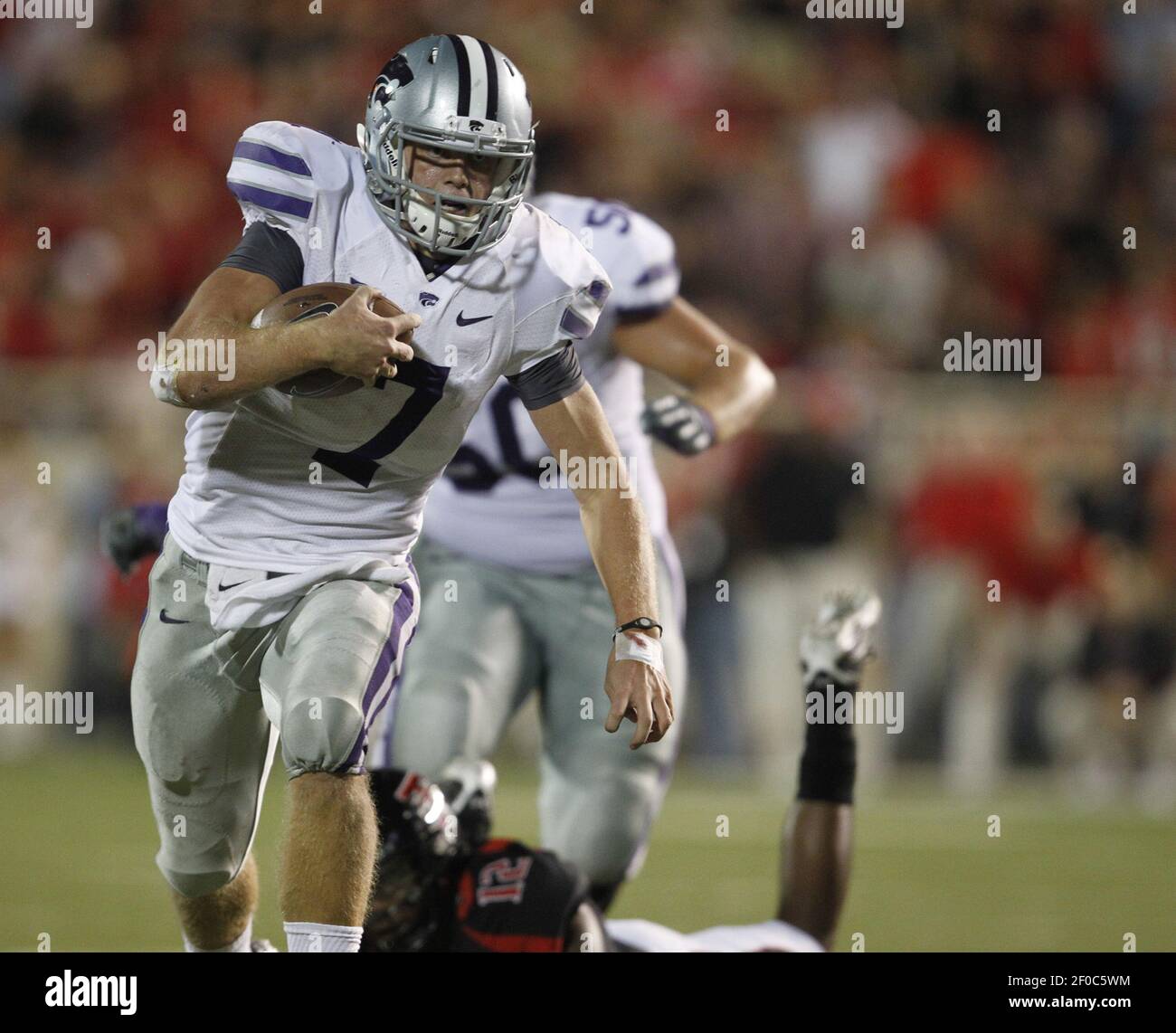 Kansas State quarterback Collin Klein (7) drives toward the goal line ...