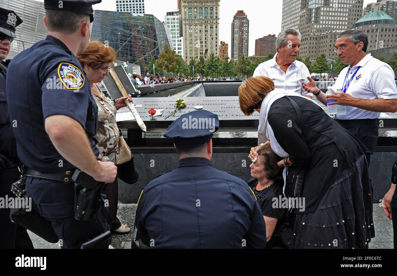 An attendee collapses at the ceremony marking the 10th anniversary of ...