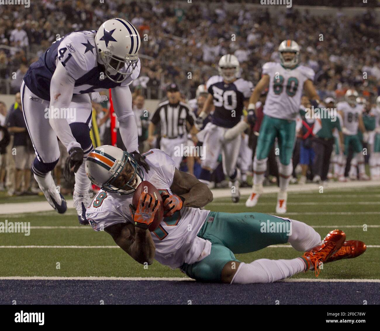 Miami Dolphins Brandon Marshall catches a touchdown pass against Dallas ...