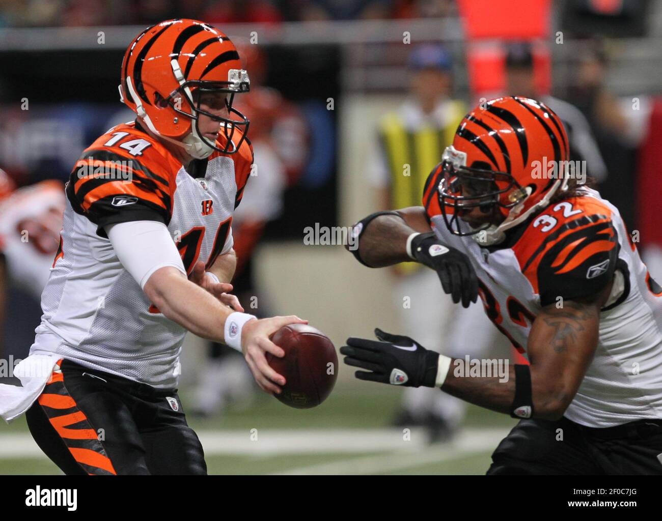 Cincinnati Bengals quarterback Andy Dalton fakes a hand-off to Cedric ...