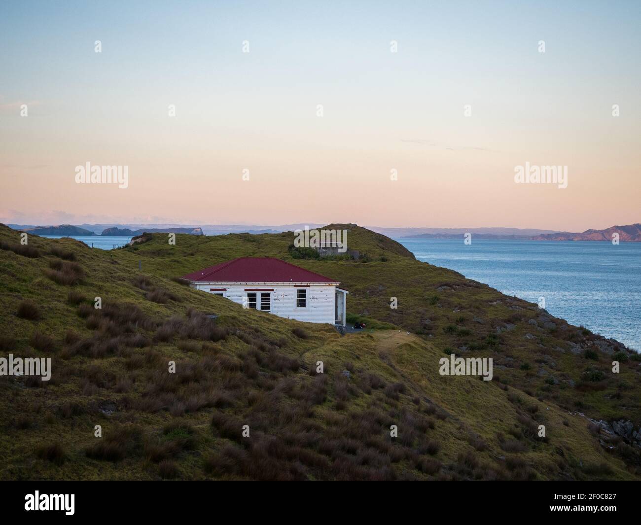 Cape Brett Lighthouse and Cape Brett Hut in Rawhiti New Zealand Stock ...