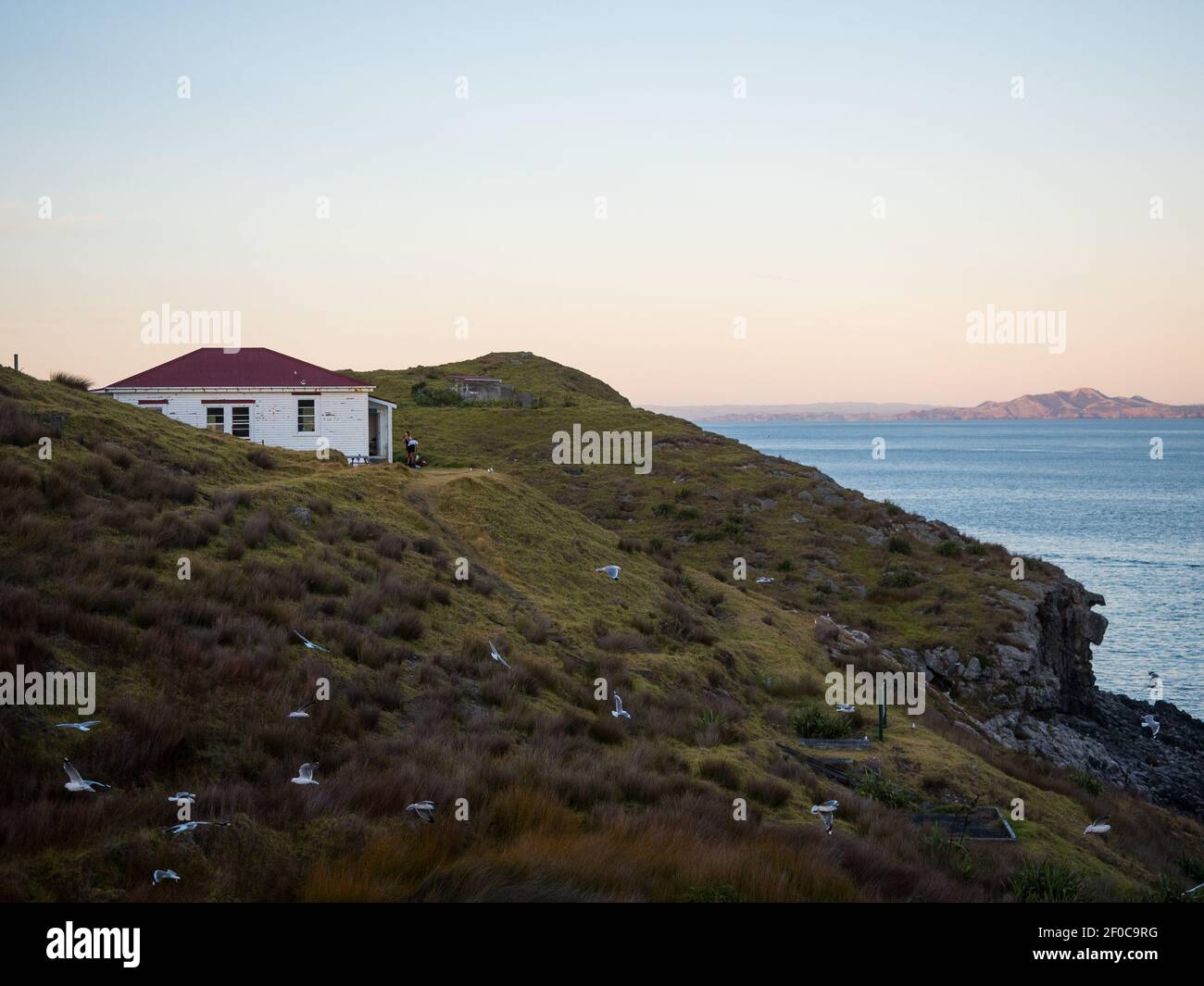 Cape Brett Lighthouse and Cape Brett Hut in Rawhiti New Zealand Stock ...