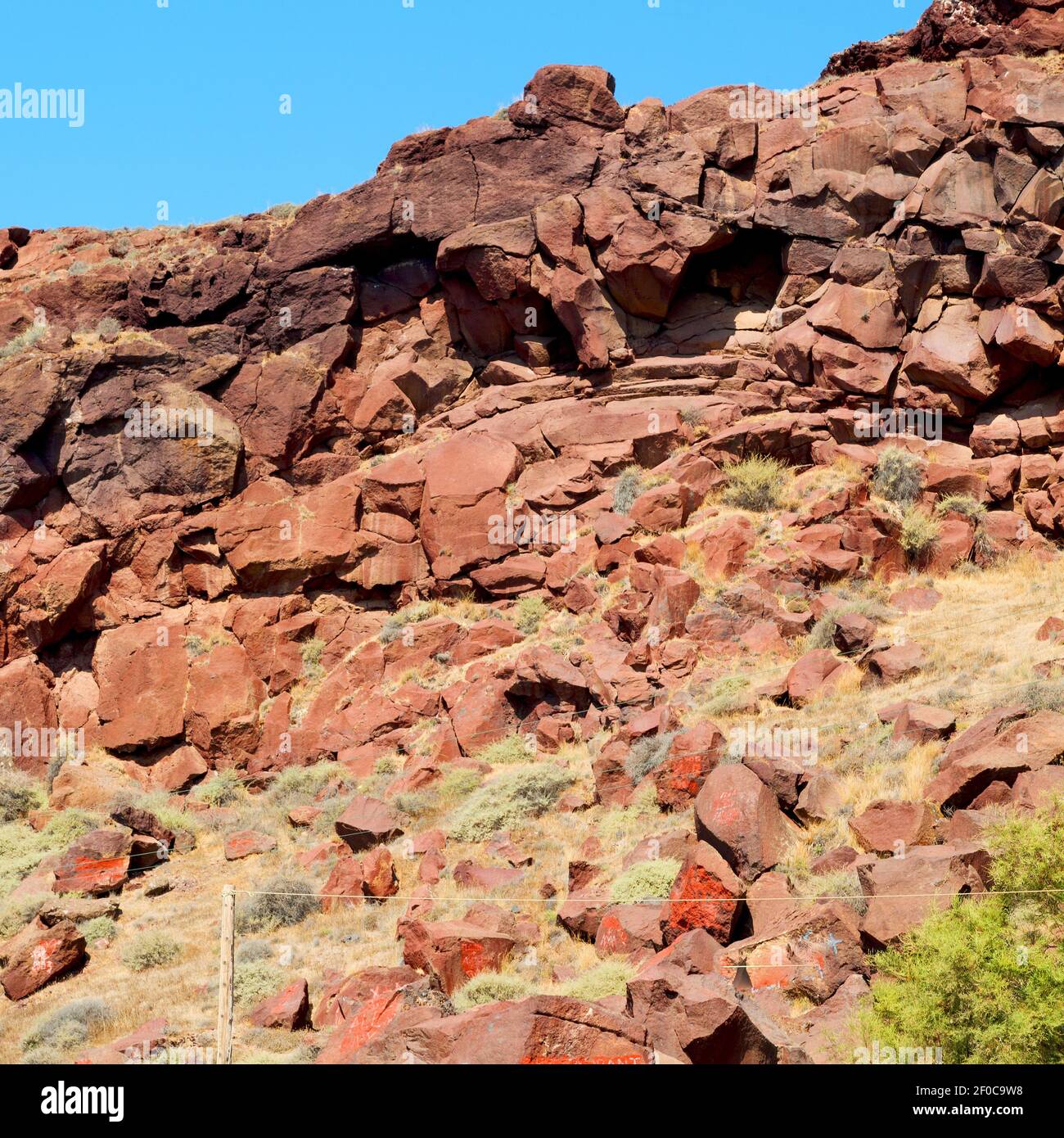 Rock alone in the sky santorini europe greece and dry bush Stock Photo ...