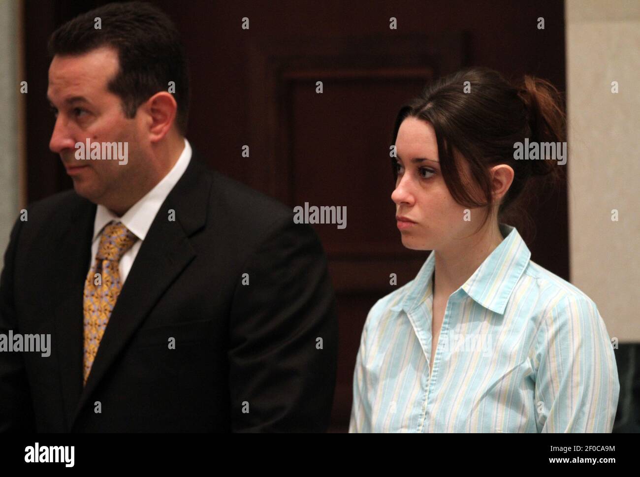 Casey Anthony, with defense attorney Jose Baez, left, listens during ...