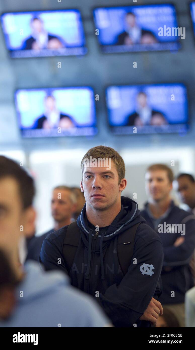 UNC quarterback Bryn Renner listens as new football coach Larry Fedora ...