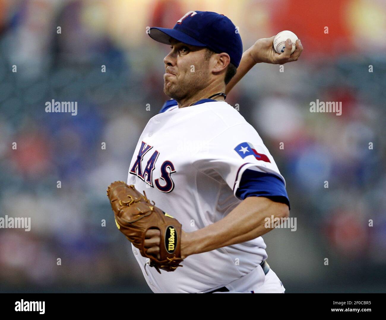 Texas Rangers starting pitcher Colby Lewis works against the Oakland ...