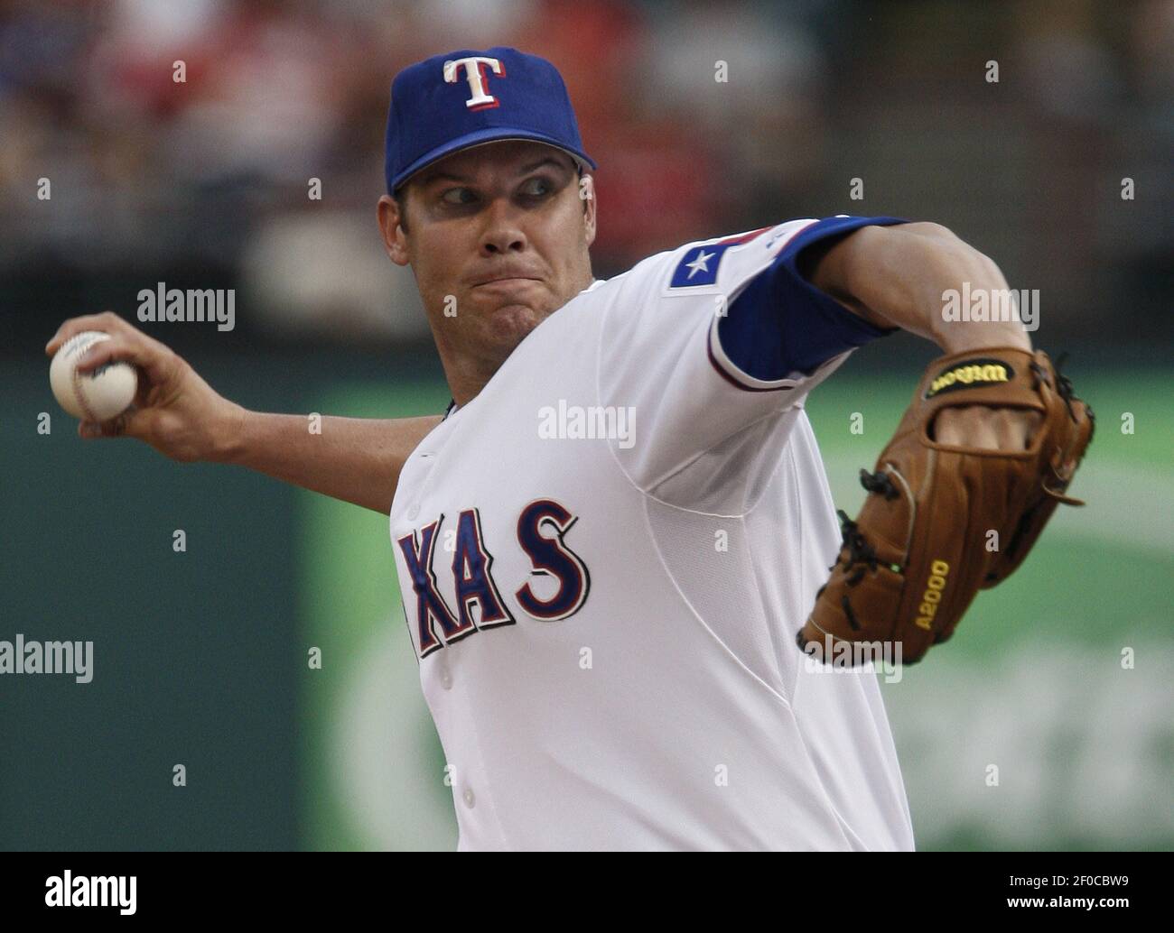 Texas Rangers starting pitcher Colby Lewis throws against the Kansas ...