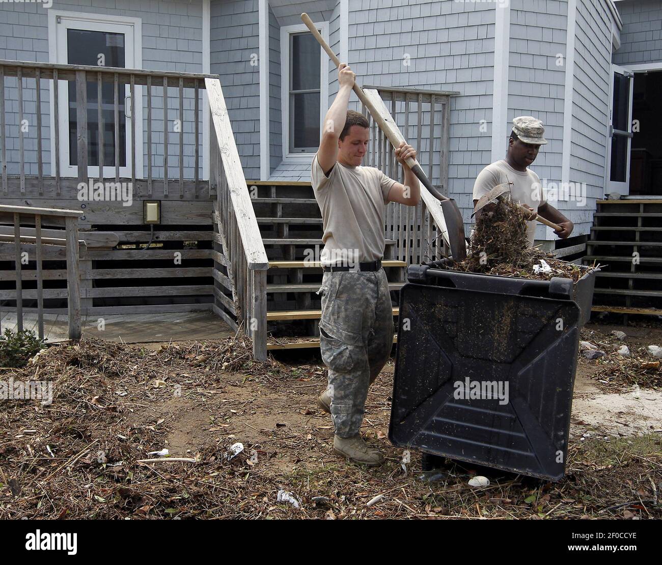 Spc. Kendall Manning, left, and PFC Leroy McBryde of the 130 MEB, help ...