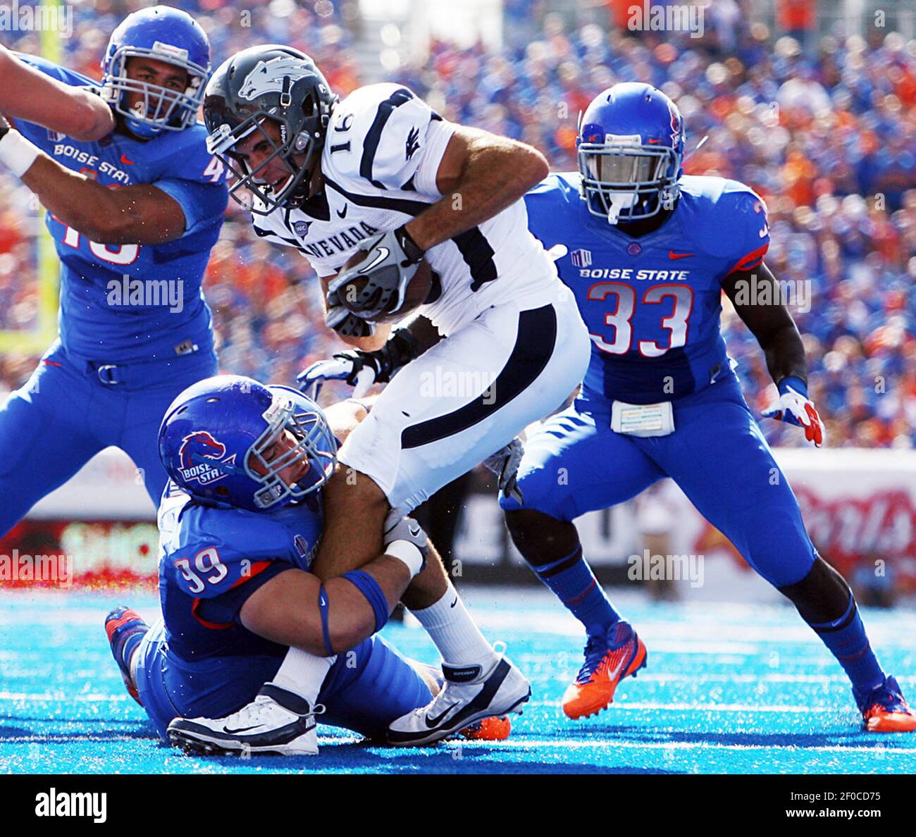 Boise State's Mike Atkinson tackles Nevada quarterback Tyler Lantrip in ...