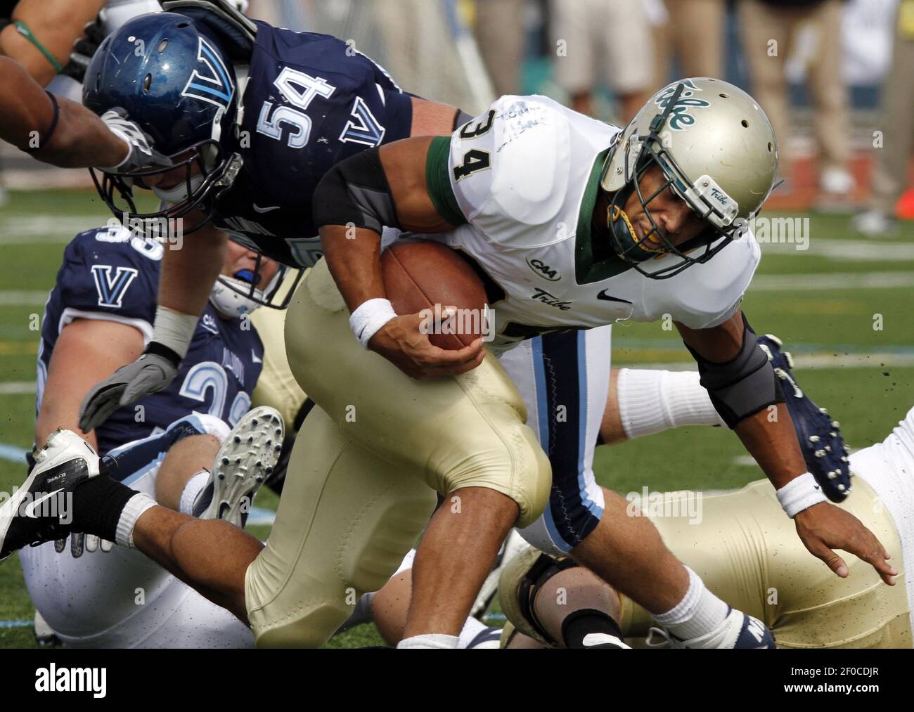 William and Mary's Jonathan Grimes is brought down by Villanova's ...
