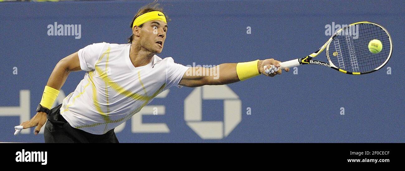 Rafael Nadal of Spain returns the ball to Andrey Golubev of Kazakhstan ...