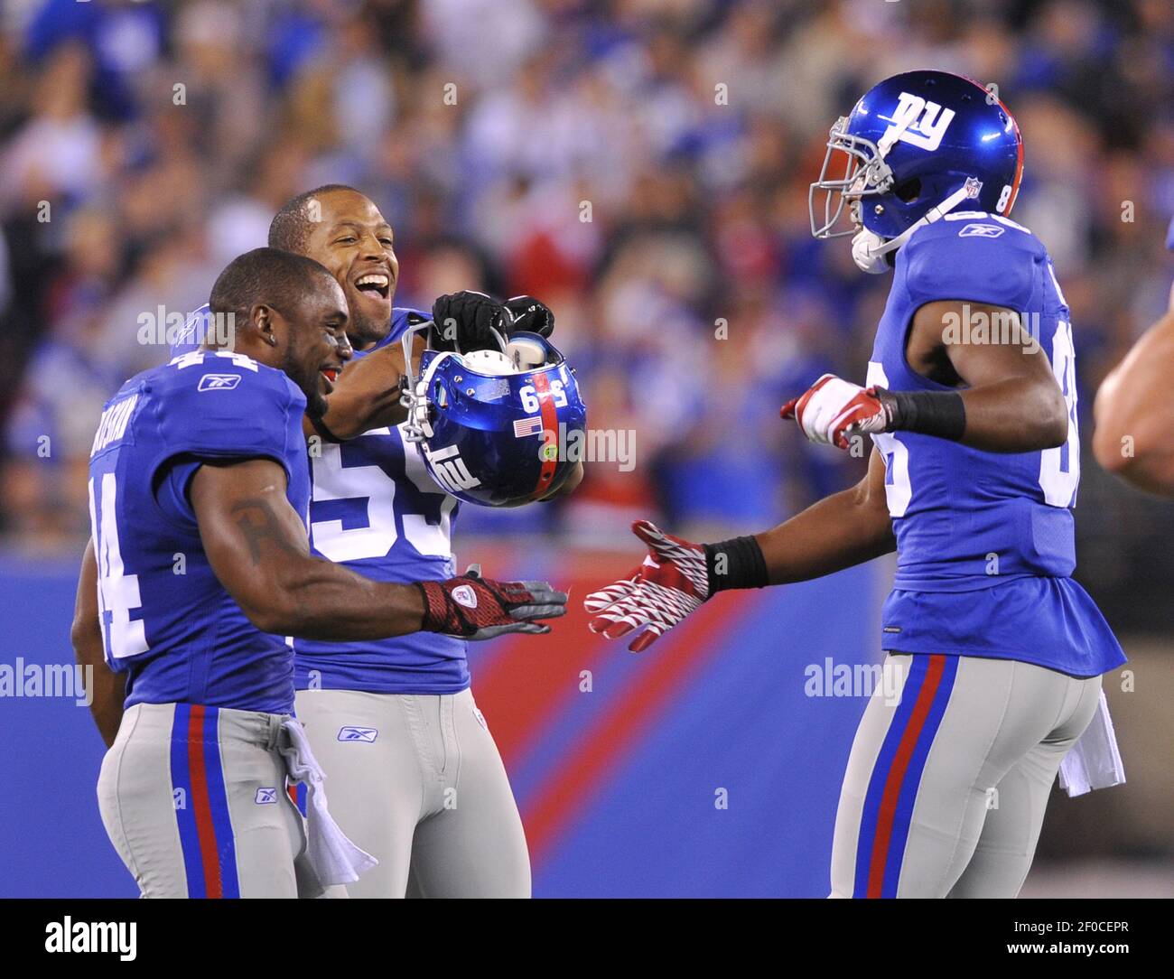 New York Giants Ahmad Bradshaw and Michael Boley greet teammate Hakeem ...