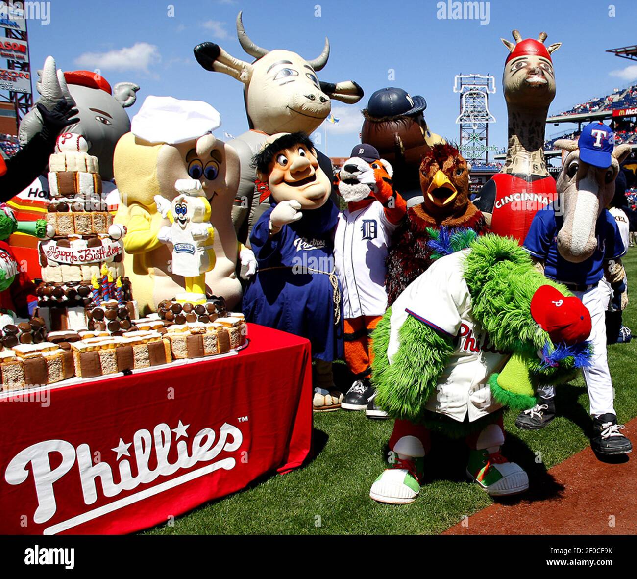 The Phillies' Phanatic, right, jokes around as fellow mascots sing ...