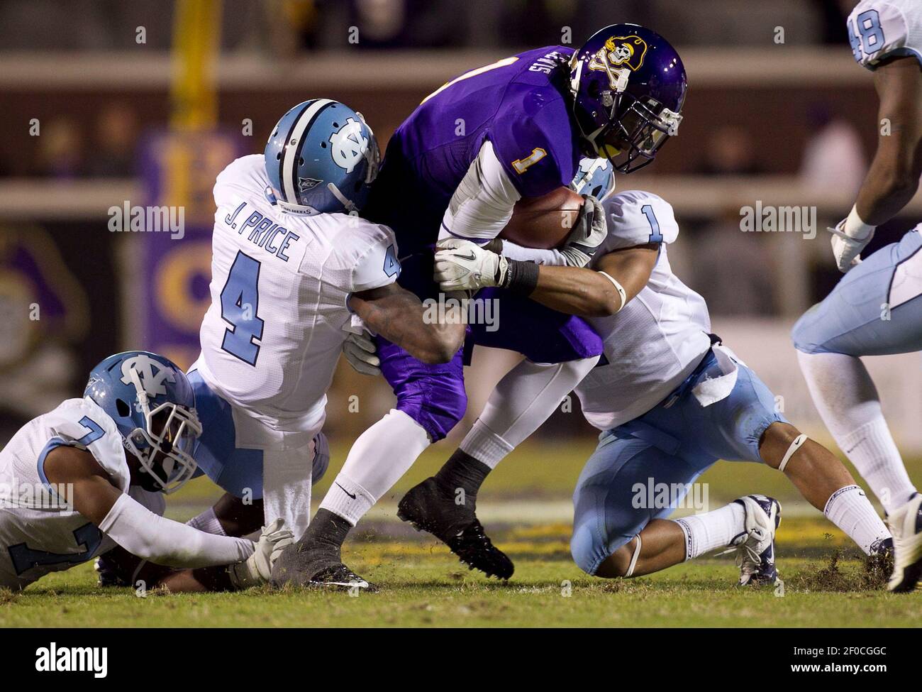 North Carolina's Jabari Price (4) and Gene Robinson (1) stop East ...