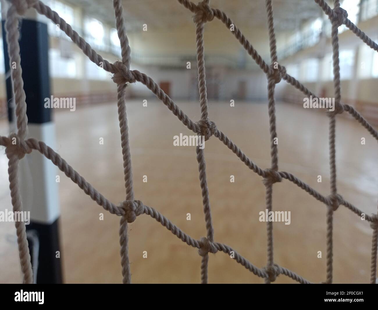 Football goal net close-up. In a sports complex. The old grid in the ...