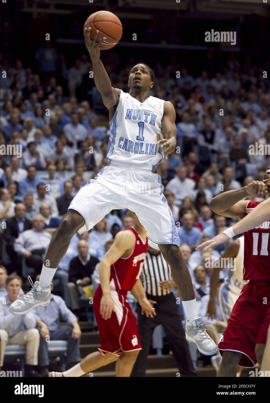 North Carolina's Dexter Strickland (1) drives past Wisconsin's Jordan ...