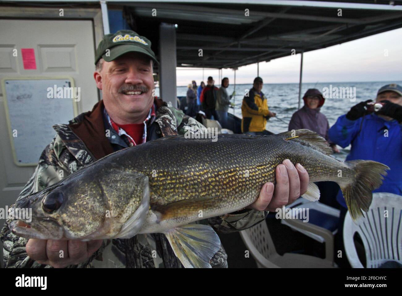 Jay Maher of St. Paul holds the 27 and three-quarter inch walleye he ...
