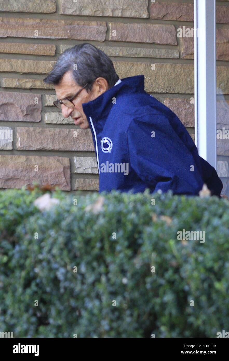 Penn State football coach Joe Paterno leaves his house for practice on ...