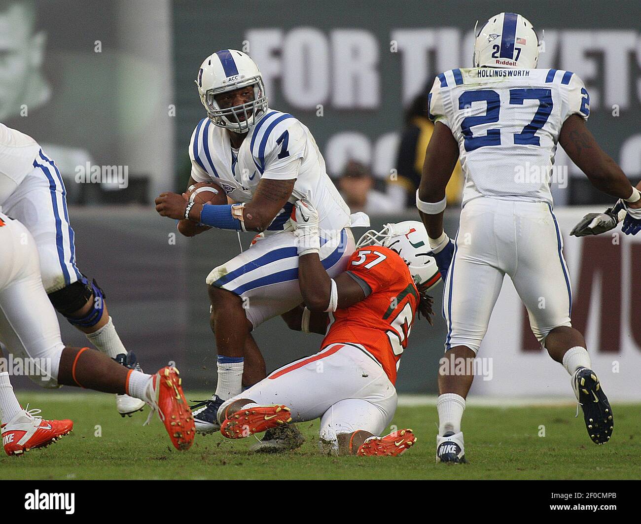 Miami's Miles Levine pulls down Duke quarterback Anthony Boone in the ...