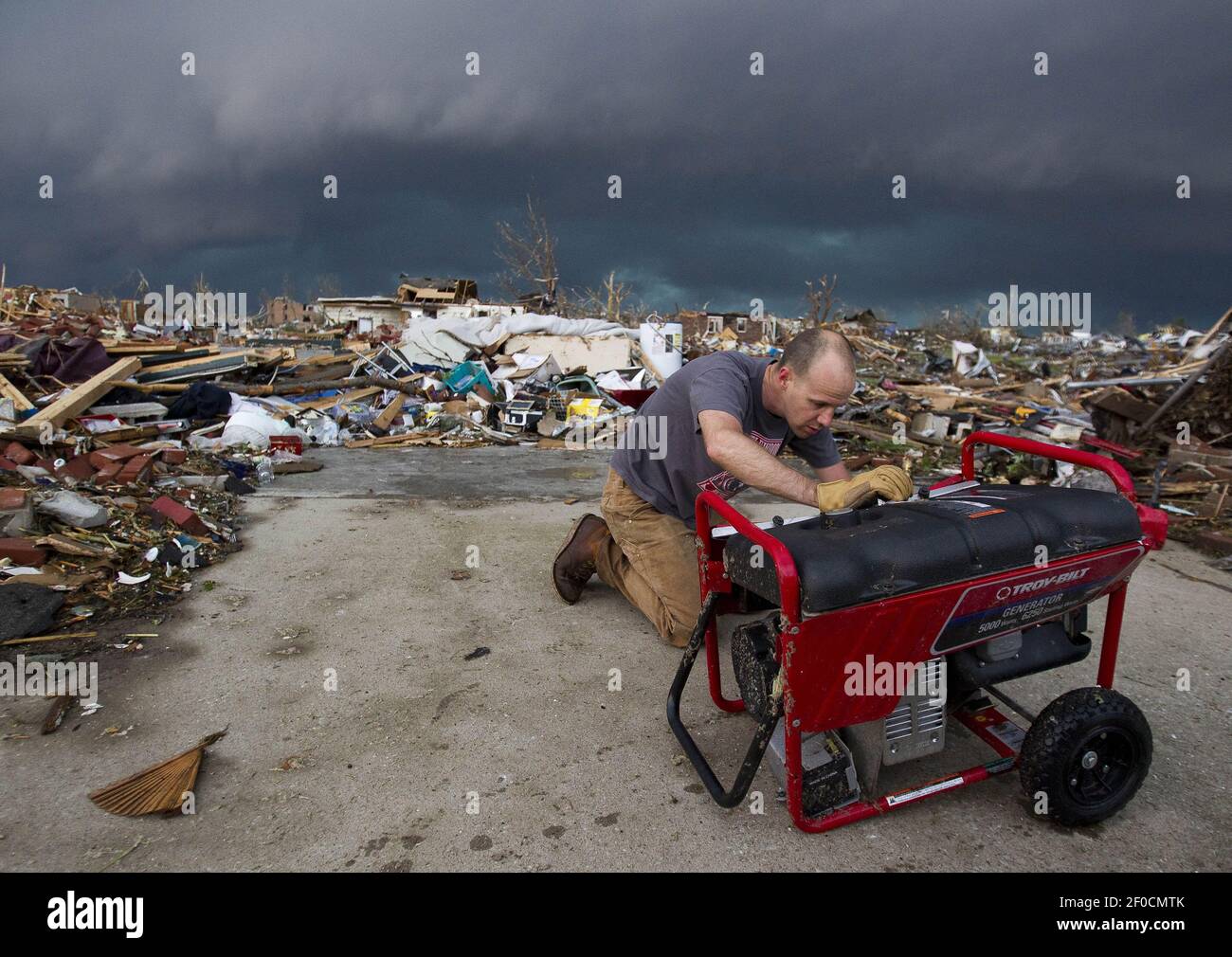 With storm clouds looming overhead, Stewart Munson, of St. Louis ...
