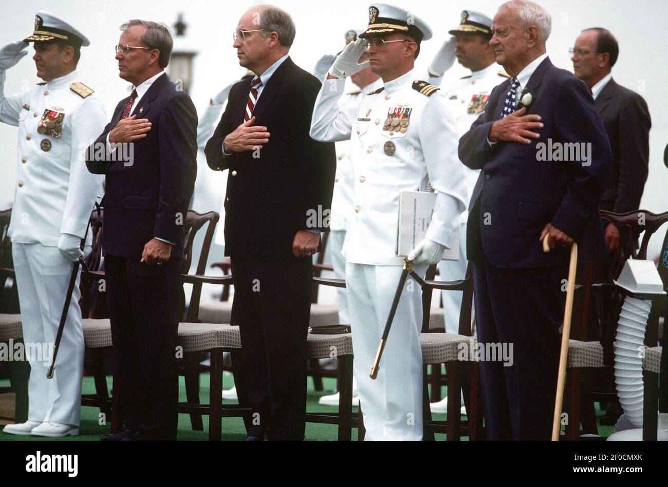 Platform guests render honors as the national anthem is played during the commissioning of the ...
