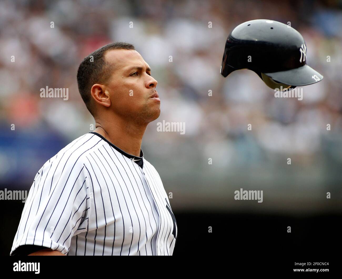 New York Yankees' Alex Rodriguez flips his helmet after lining out to ...