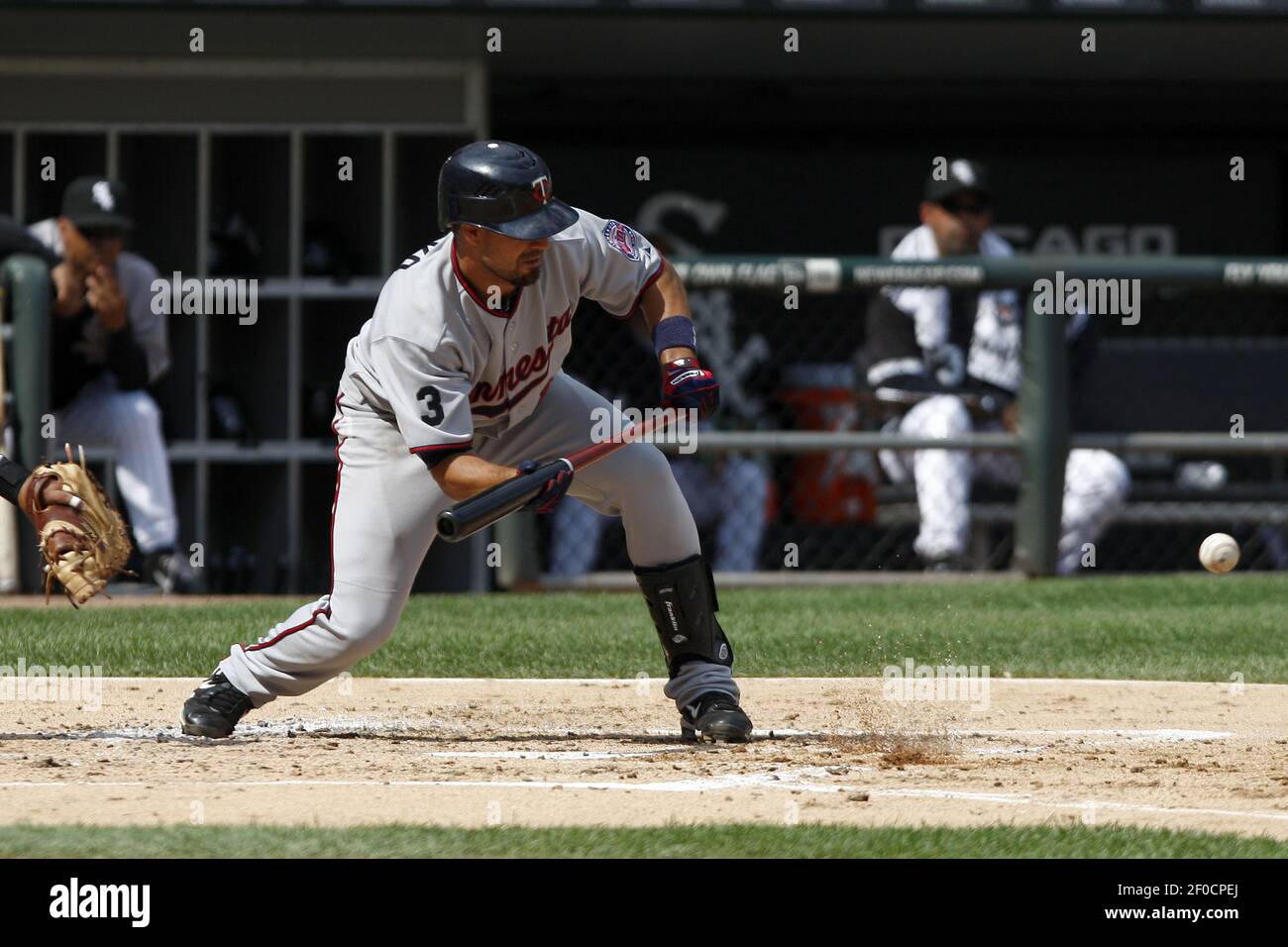 The Minnesota Twins' Jason Repko bunts to help bring two batters in ...