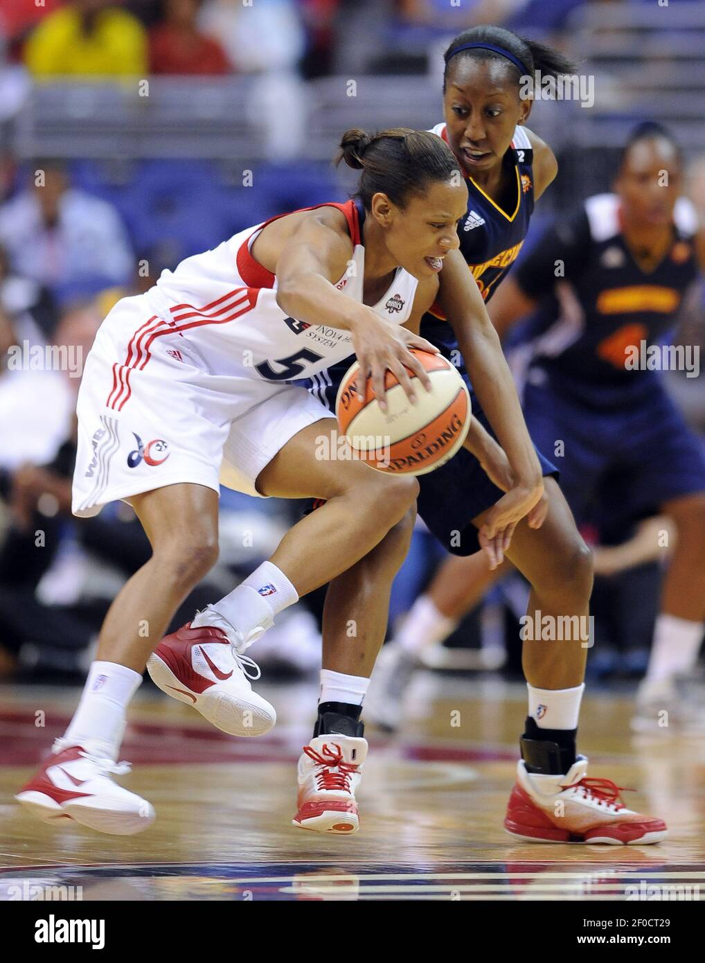 Washington Mystics guard Jasmine Thomas (5) loses her footing as she ...