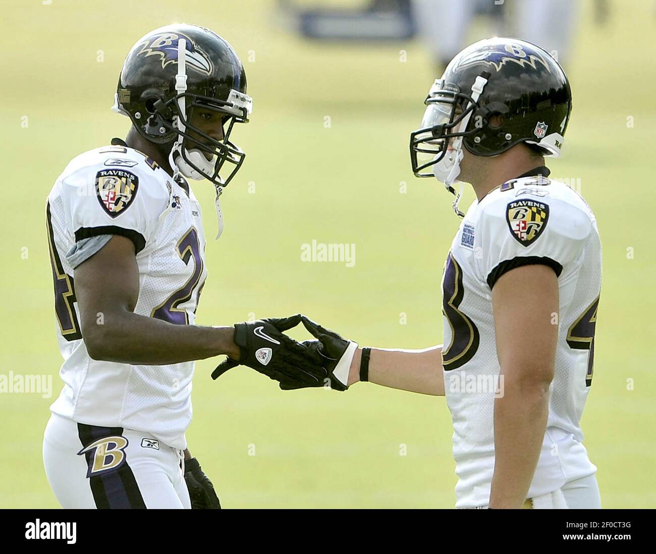 Baltimore Ravens' Domonique Foxworth, left, and Baltimore Ravens ...
