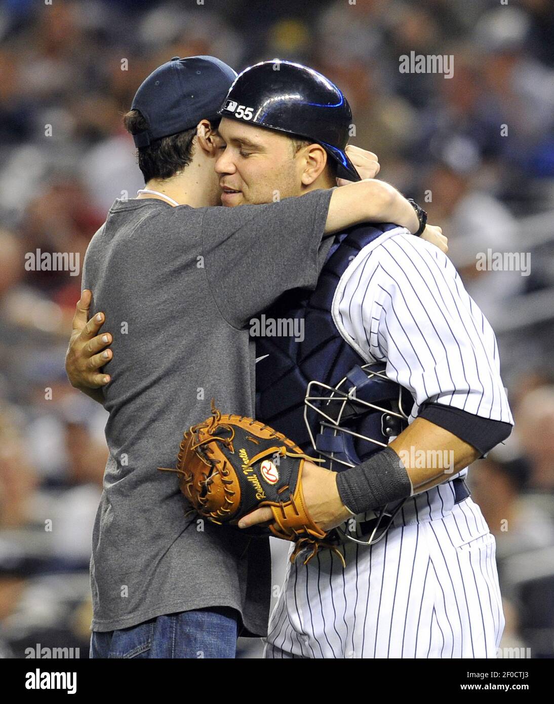 New York Yankees catcher Russell Martin gets a hug from Daniel Trush ...