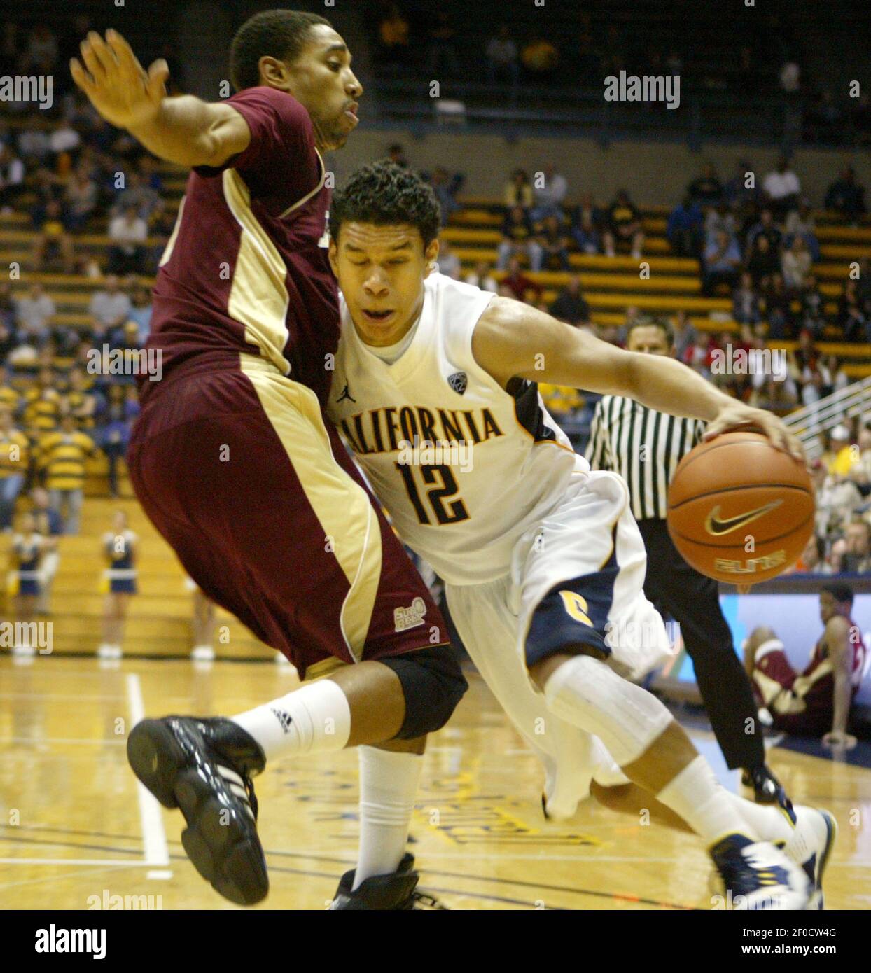 Brandon Smith (12) of Cal tries to drive by Blake Foeman (14) of Denver ...